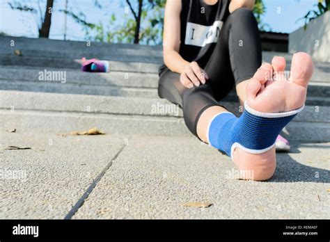 Hand Female Using Elastic Bandage With Legsfemale Putting Bandage On