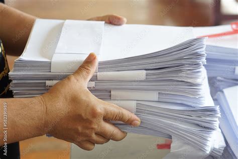 Closeup Hands Hold Stack Of Used Paper To Recycle Or Combine To Use