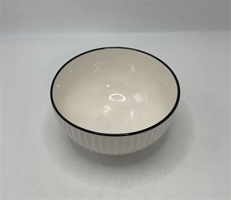 TAZA CERÁMICA BLANCA BORDE NEGRA UND Grupo Yuan Dong