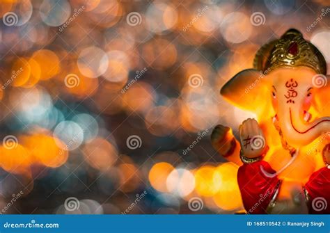 front view of illuminated ganesha dense bokeh in the background