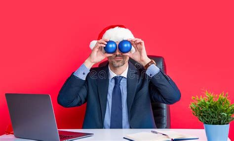 Funny Mature Man Wear Red Santa Claus Hat Hold Christmas Decoration