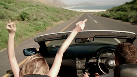 Excited Woman Raises Arms Convertible While Stock Footage Video 100