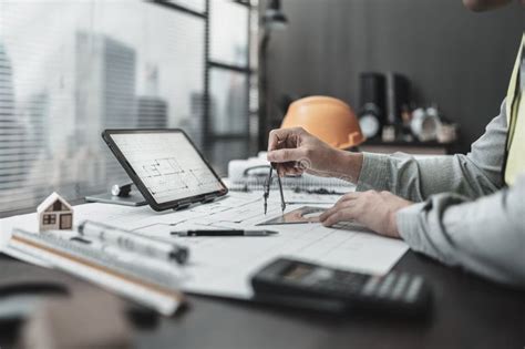 Architect Using Divider Compass Working On Blueprint House Planning Design And Construction