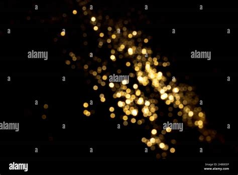 Golden Blurred Bokeh Lights On Black Background Glitter Sparkle Stars