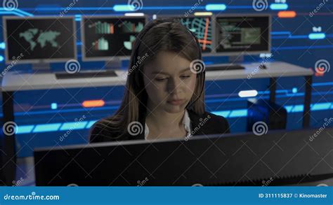 Technical Support In Control Room Female It Specialists In Headsets Work On Computers Big
