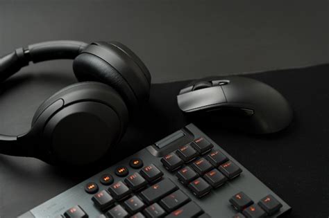 Premium Photo Headphones Computer Mouse And Keyboard On Black Background