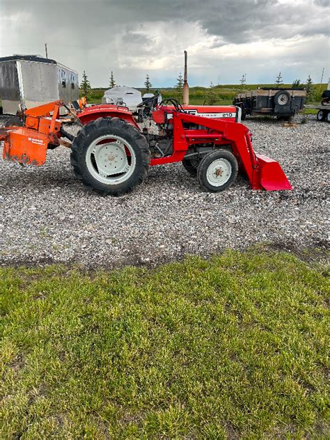 Massey Ferguson 210 Tractor With Front End Loader And Attachments