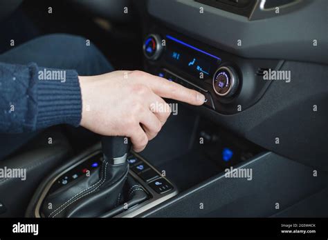 Male Driver Controls The Settings Of His Car With Buttons Stock Photo Alamy