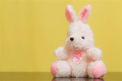 Premium Photo Pink Bunny Doll Brown Background