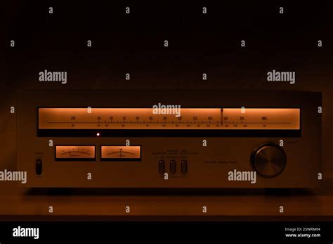 A Vintage Analog Radio Receiver With A Glowing Illuminated Am Fm Tuning Display Perfect For