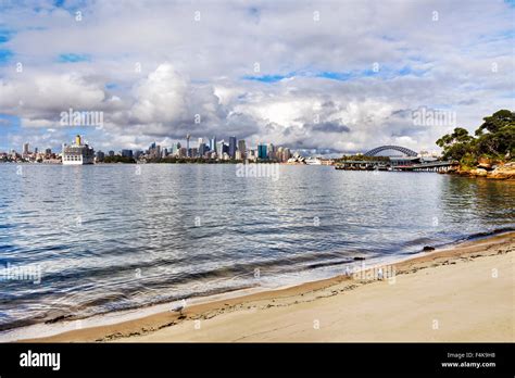 Sydney Harbour With Bridge And Cbd Cityscape Landmarks At The Horizon