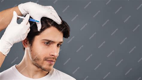 Premium Photo Man With Hair Loss Problem Receiving Injection In Head