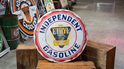 Independent Gasoline With Ethyl Double Sided Porcelain Sign At The