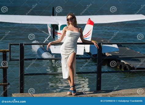 Young Travelling Woman In Fashion Dress Enjoying The View Of Como Italy