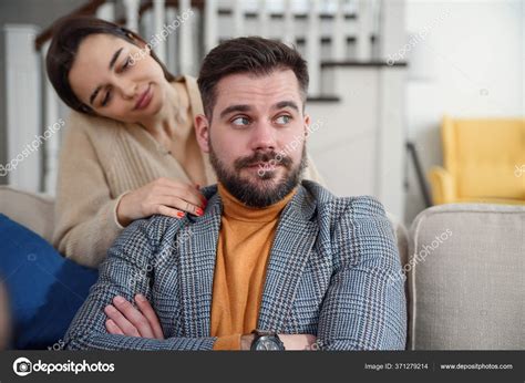 Attractive Woman Apologizing To Frustrated Man After Quarrel Doubting Babefriend Ignore