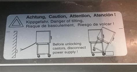 The Caution Sticker On My Oven Looks Like An Oven Trying To Awkwardly Leave A Room Two Ovens Are