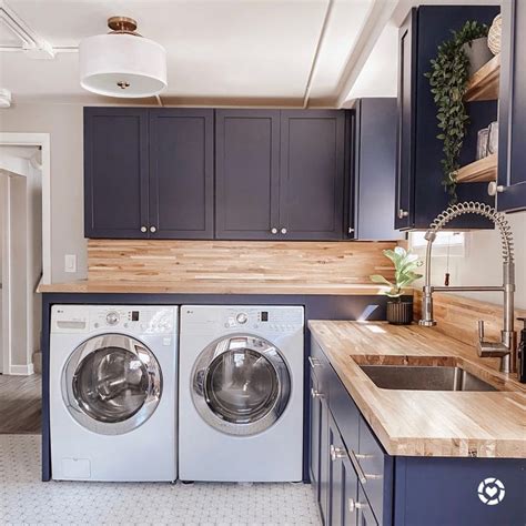 Mid Century Modern Laundry Room With Blue Cabinets And Butcher Block