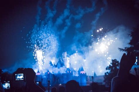 Premium Photo People Photographing Fireworks Exploding At Night