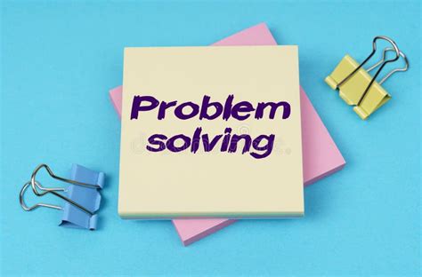 on the table are paper clips note paper with text problem solving
