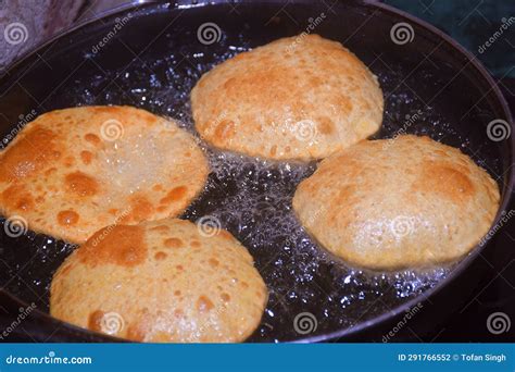 Frying Chapati Poori On Frying Pan Boiling Oil In Frying Pan With Dark Background Kitchen