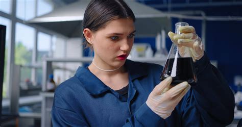 Group Of Young Ecologists Doing Analysis In Laboratory Environment