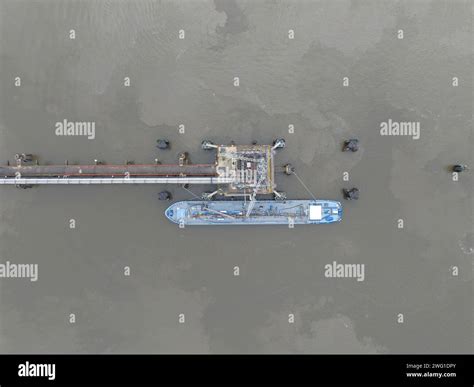Top Down View On A Inland Shipping Bulk Carrier Docked Moored At A Loading And Unloading