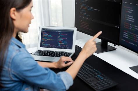 Young Asian In It Developer Pointing Online Information On Pc