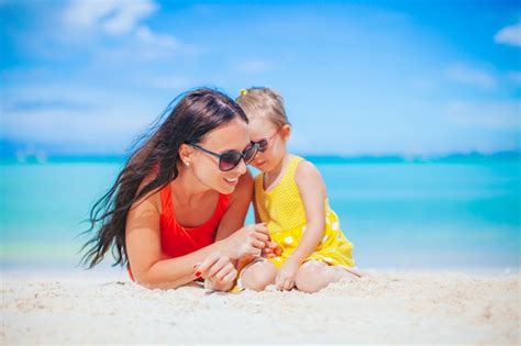 Premium Photo Beautiful Mother And Daughter At The Beach Enjoying