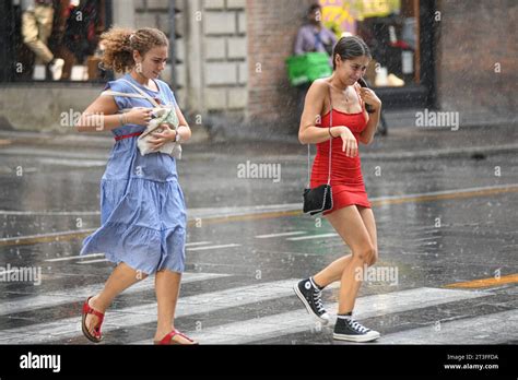 Italian Young Girls Crossing The Street In The Rain Via Ugo Bassi