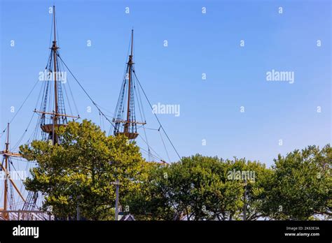 Tall Ship Mast Of The Mayflower Ii Behind Tree Tops Seen From The