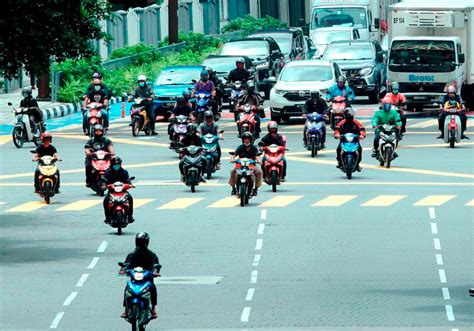 Woman Injured After Motorcycle Knocked By Billboard