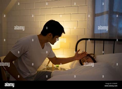 A Man Is Take Care Girlfriend At Night Couple And Care Concept Stock