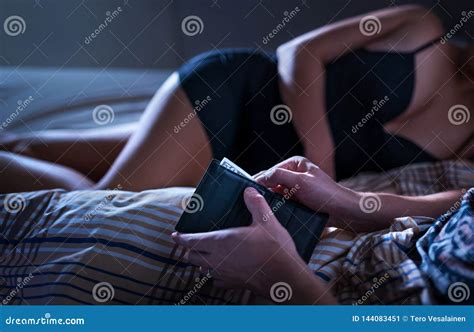 Escort Or Paid Woman Lying On Bed In Brothel Man Paying Money For Sex