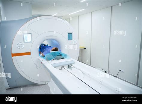 Adult Person Undergoing Magnetic Resonance Imaging Of Lower Extremity