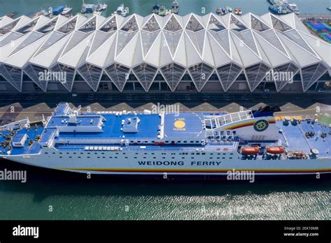 An Aerial View Of A Cruise Harboring At Qingdao Cruise Terminal