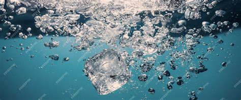 Premium Photo Water Splashing And Ice Cube Ice Splashing Into A Glass