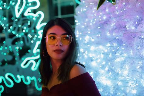 Premium Photo Young Woman Wearing Eyeglasses At Night