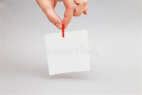 Human Hand Holding Sticker With Empty Mockup For Your Text Hanging On
