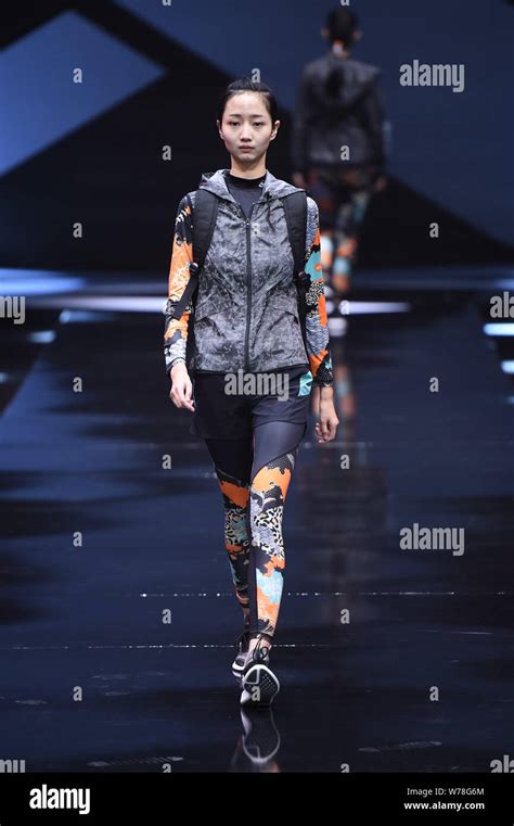 A Model Displays A New Creation At The Fashion Show Of Xiang Shang