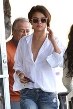 Selena Gomez Unbuttons Her Shirt For The Paparazzi