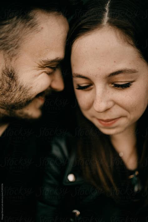 Young Couple Snuggling By Stocksy Contributor Mango Street Lab