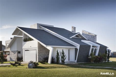 Pitched Roofline On House Morphs Into Angled Facade