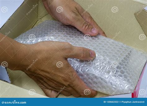 Hand Man Hold Bubble Wrap For Packing And Protection Product Cracked