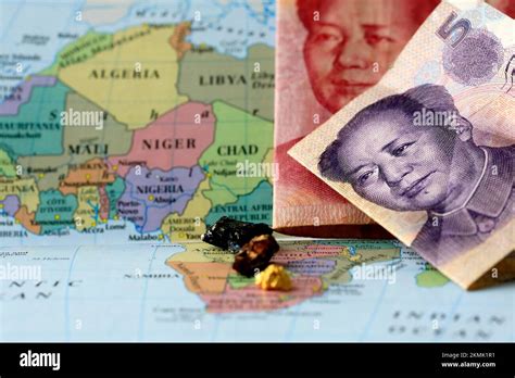 Close Up Of A Yuan Chinese Banknote And Rare Earth Metals On Top Of A