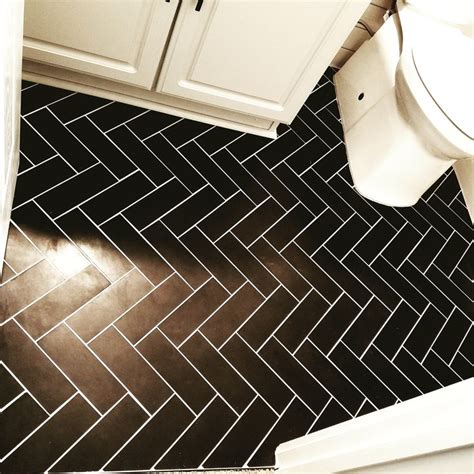 Black Herringbone Floor With Platinum Grout