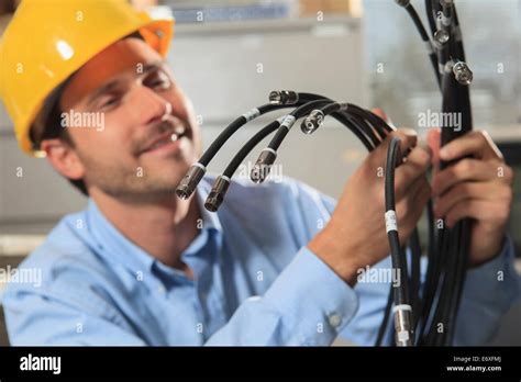 Network Engineer Preparing Structured Cabling For Data Center Stock