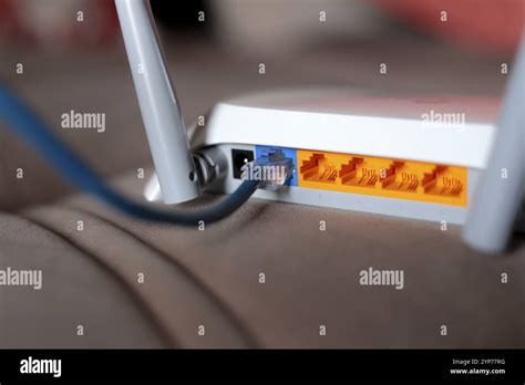 In This Photo Illustration Blue Internet Network Cable Connected To A Wi Fi Signal Receiver