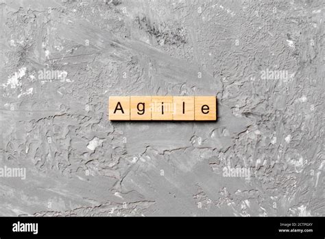 Agile Word Written On Wood Block Agile Text On Cement Table For Your Desing Concept Stock