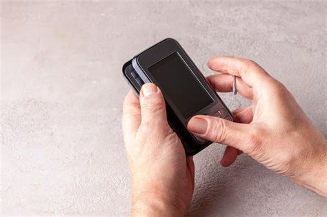 Premium Photo Male Hands Holding A Smartphone With A Slide Out Keyboard And A Stylus