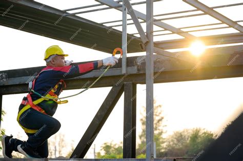 Premium Photo Asian Male Construction Worker Working At Height Wear Safety Gear And Safety